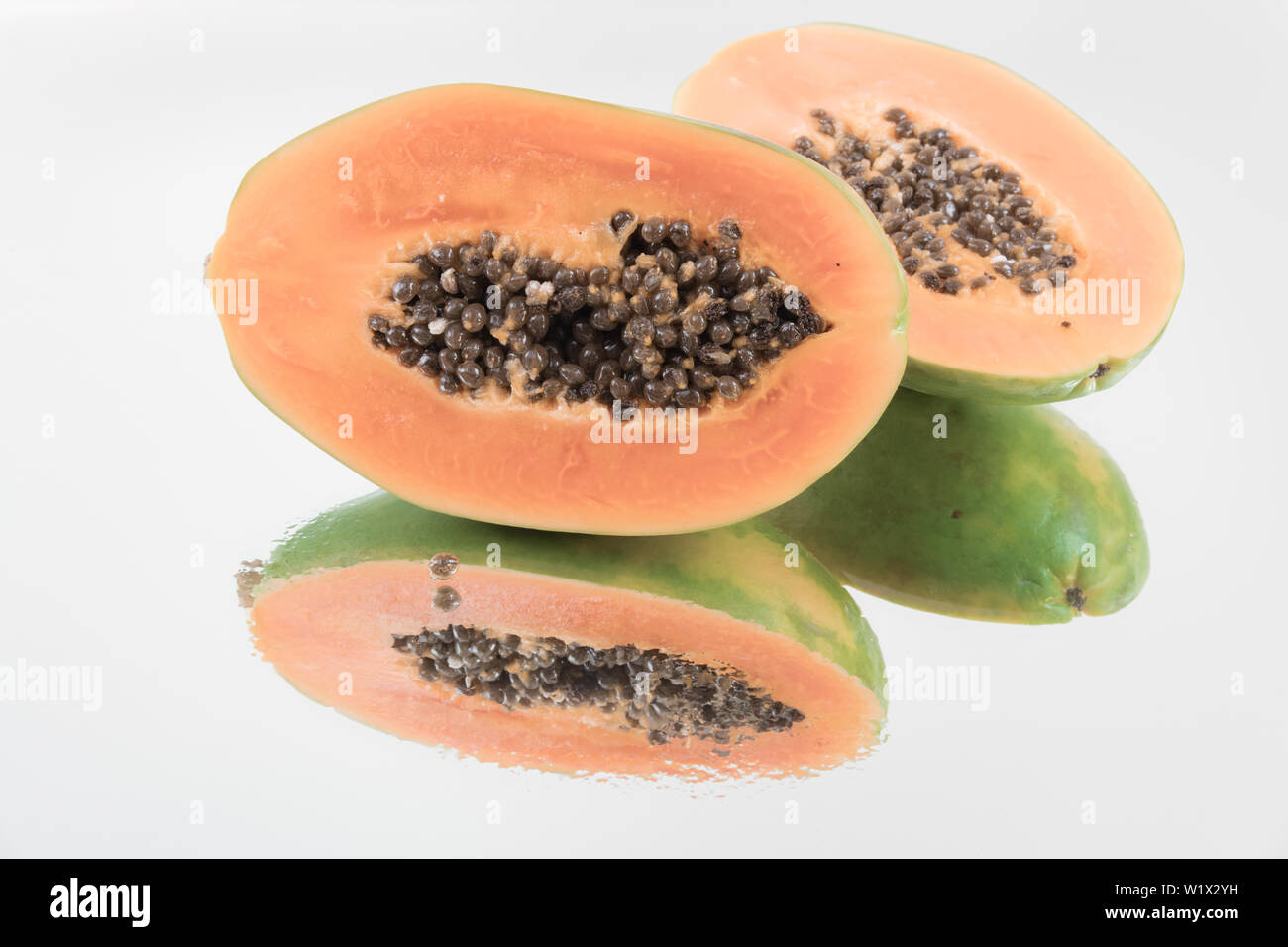 abstract composition, two half of yellow papaya with the peel ...