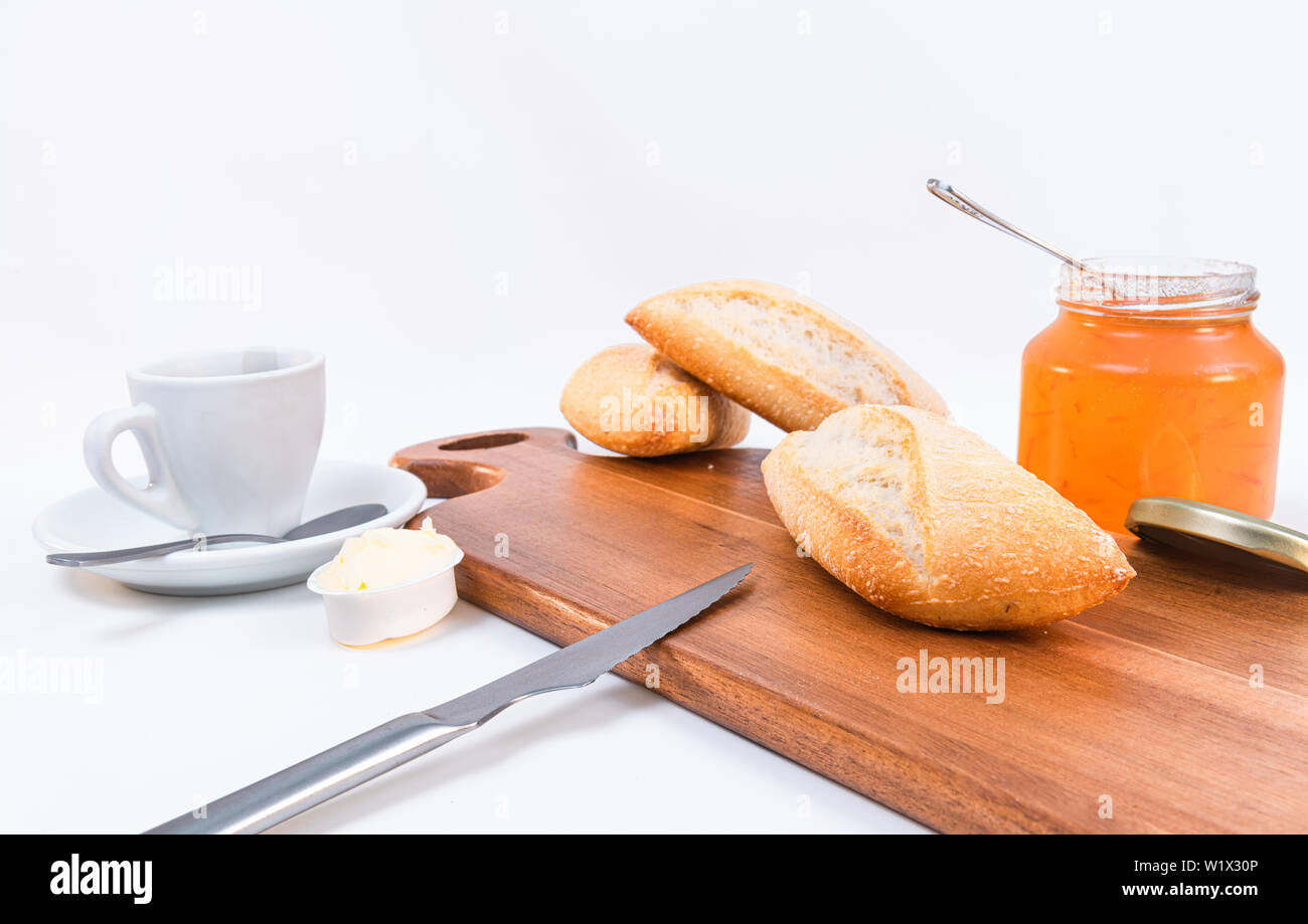 Wooden board with tasty breakfast toasts on white background Stock ...