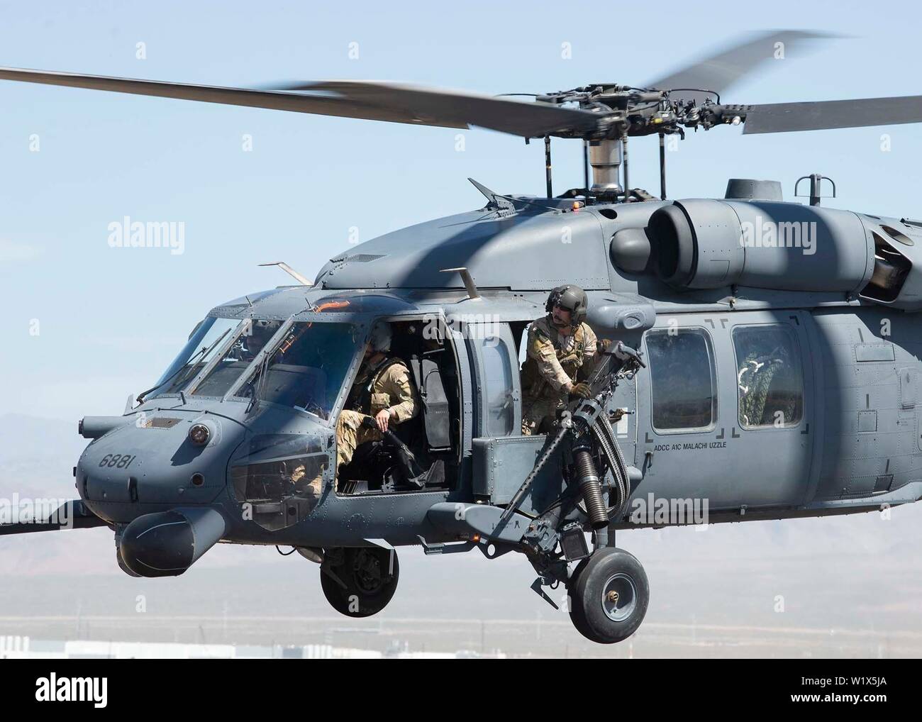 A Special Missions Aviator assigned to the 66th Rescue Squadron leans ...