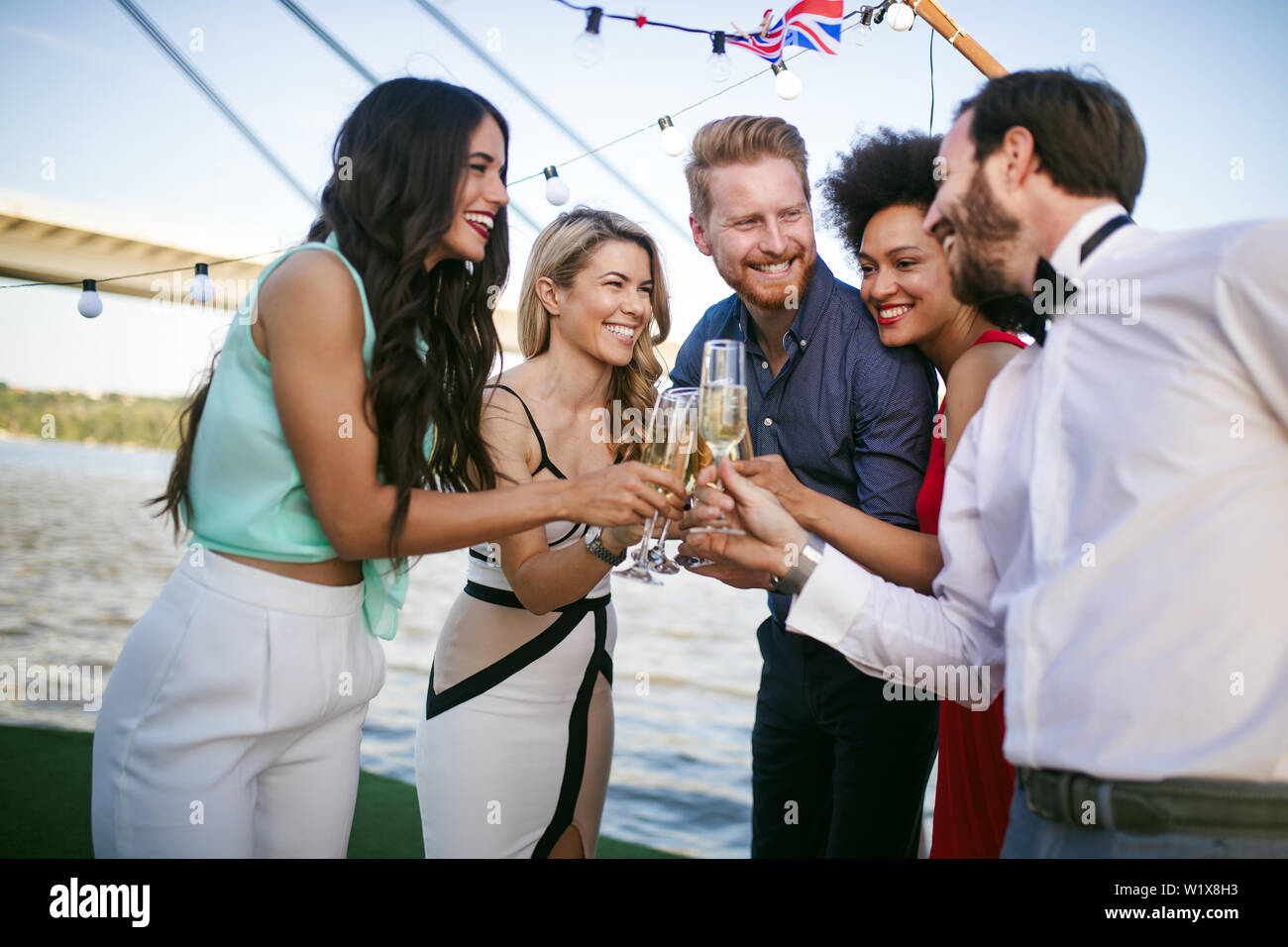 Group of friends having fun and celebrating group gathering Stock Photo ...