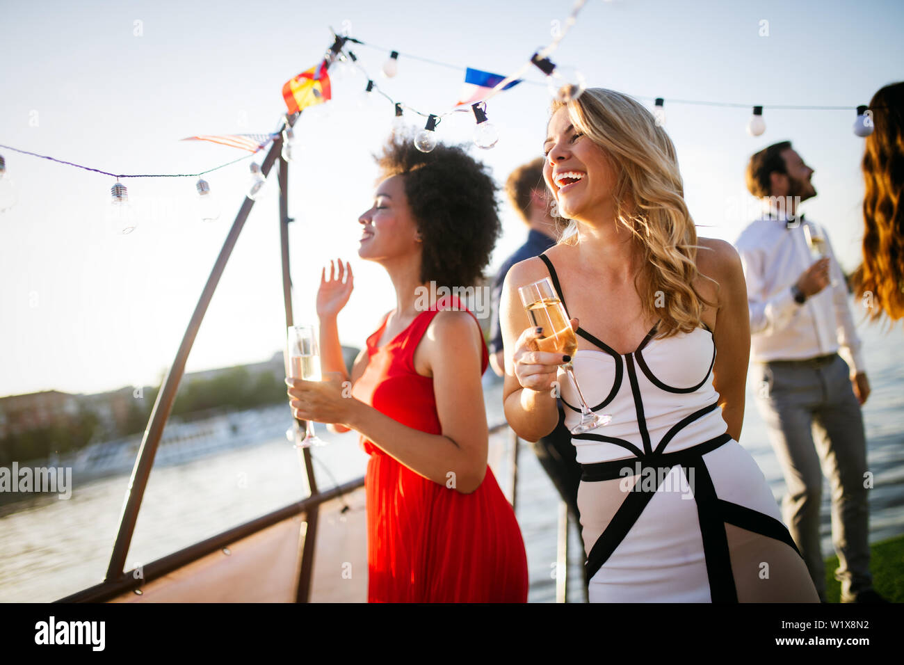 Group of happy people or friends having fun at party Stock Photo - Alamy