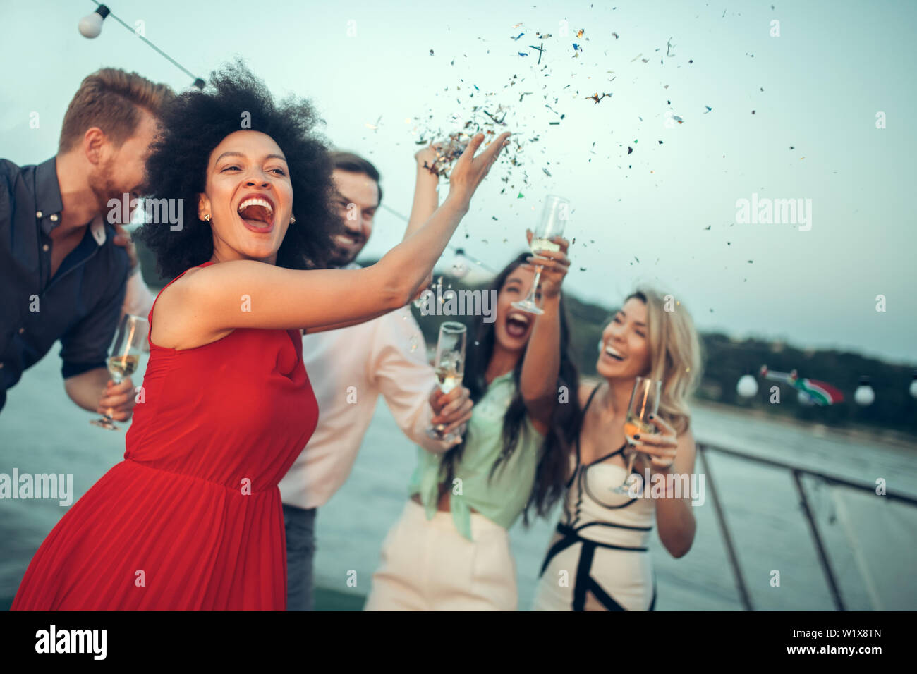 Group of happy people or friends having fun at party Stock Photo - Alamy