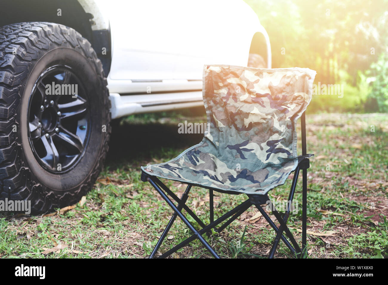 Folding chair on the Camping with Off road pickup and sunlight ...