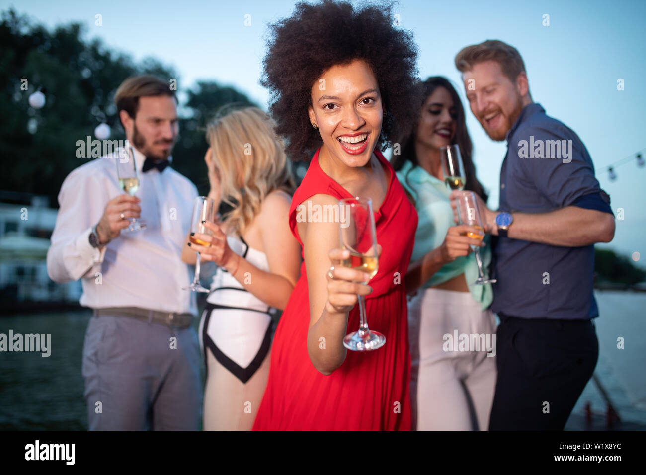Group of happy people or friends having fun at party Stock Photo - Alamy