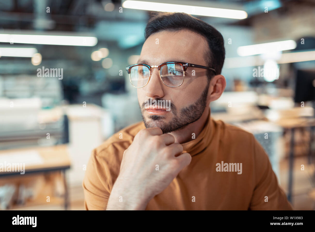 Bearded writer. Handsome bearded writer wearing glasses feeling excited ...