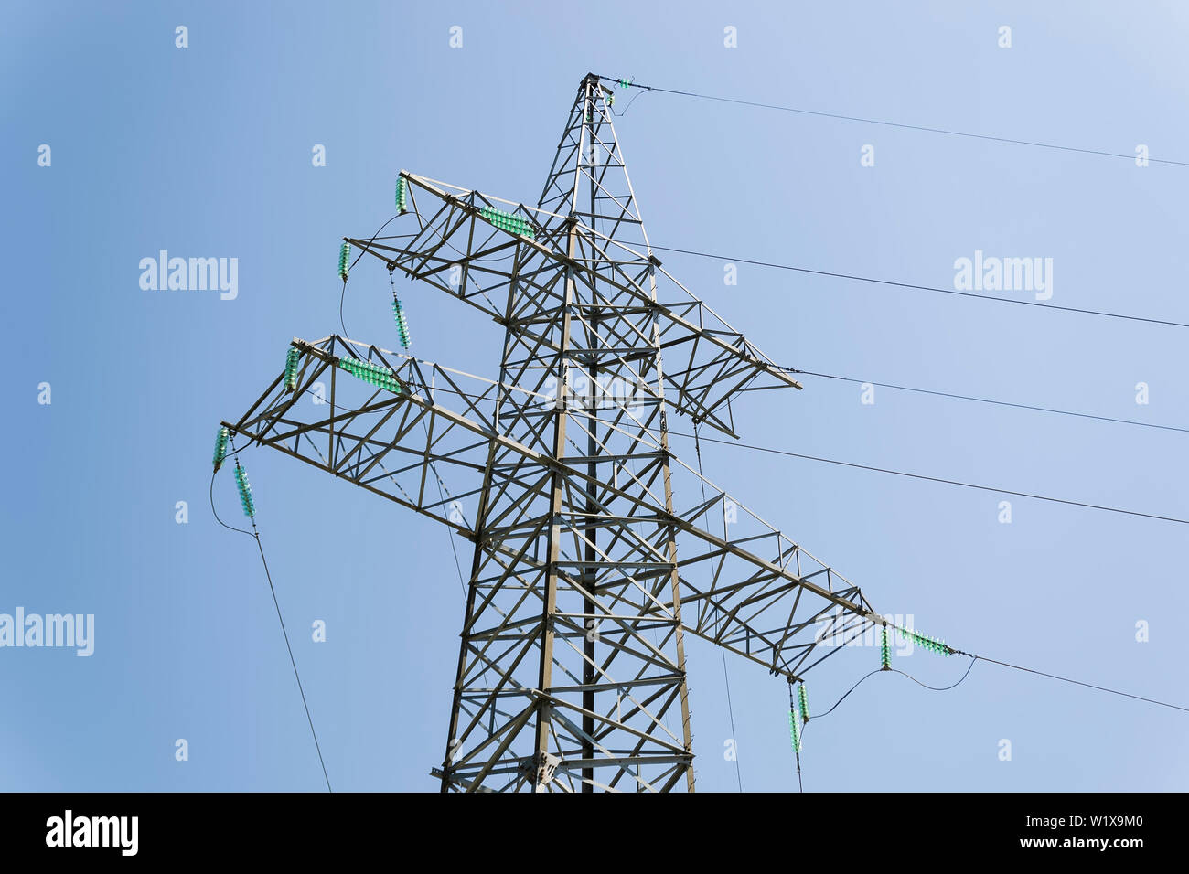 Power line tower. Blue sky background Stock Photo - Alamy