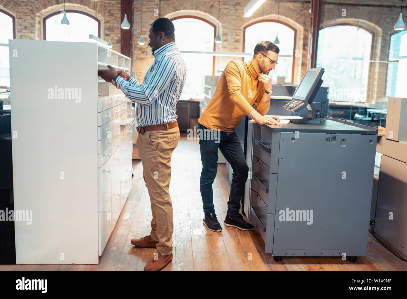 Two cooperating work hi-res stock photography and images - Alamy