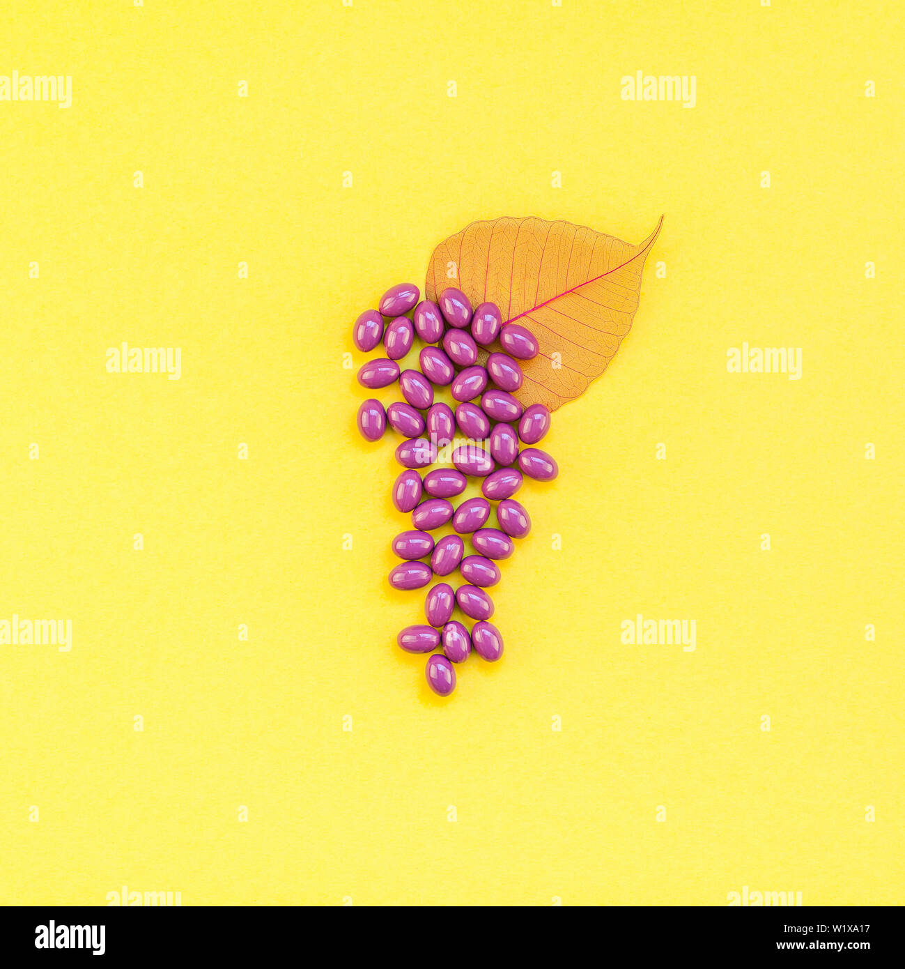 Purple nutritional supplement Grape seed extract pills in bunch of ...