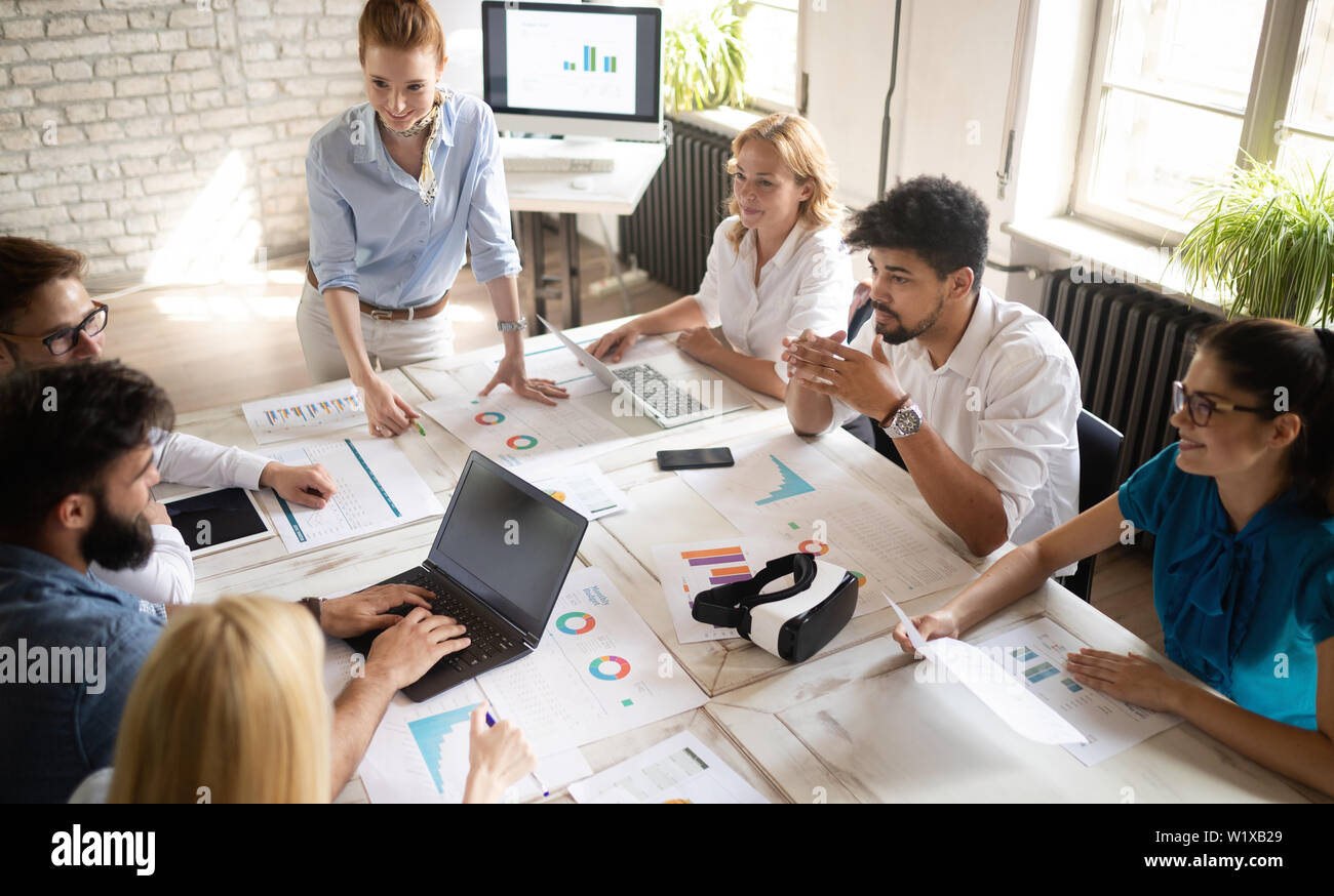 Happy creative team in office. Business, startup, design, people and ...