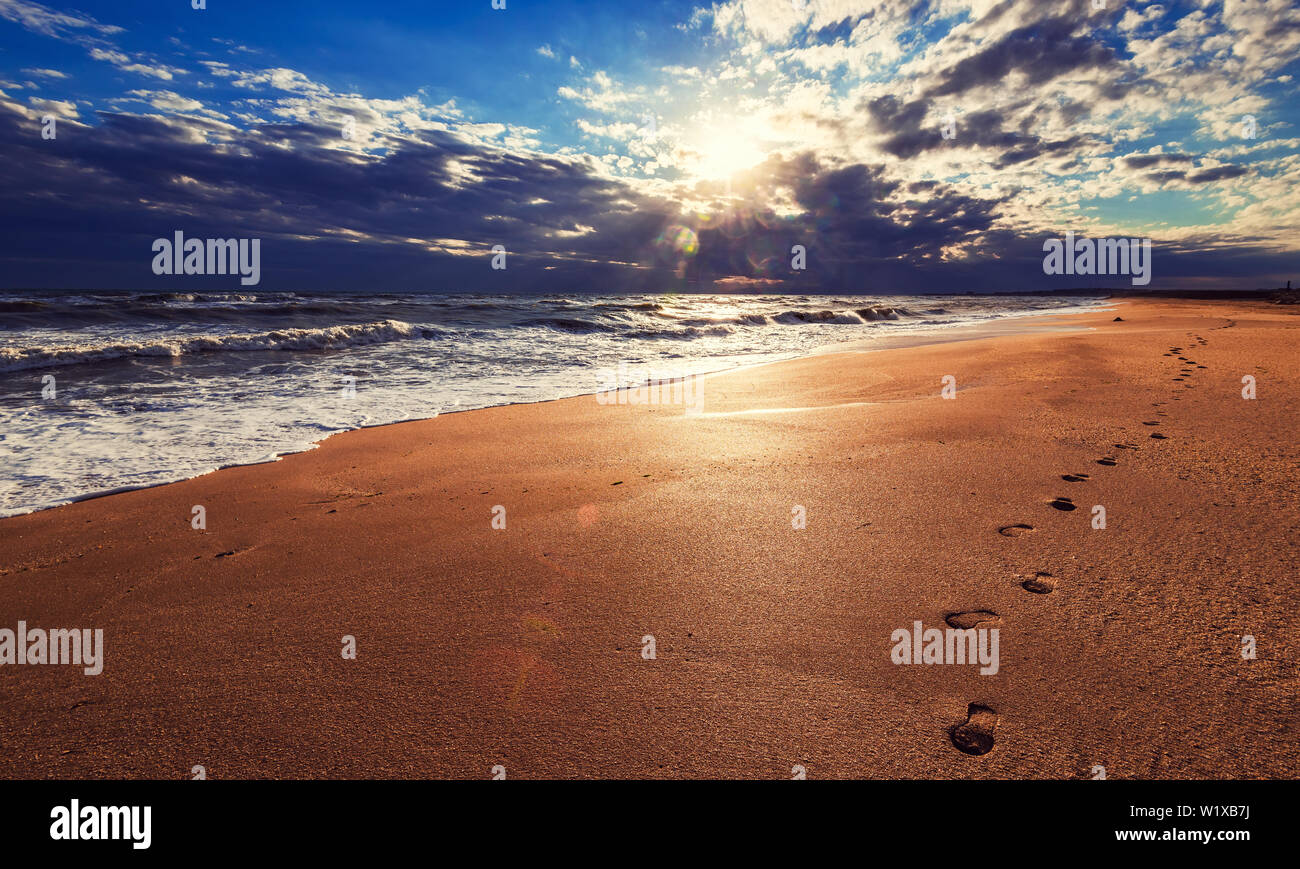 Human footprints on a empty sea beach Stock Photo - Alamy