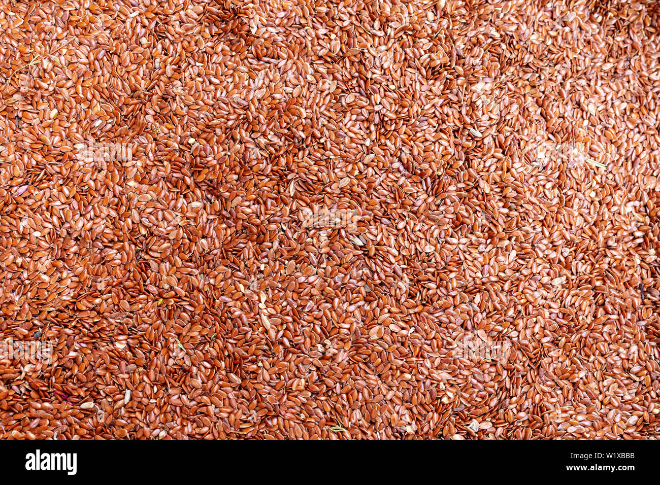 Brown raw flaxseeds background texture hi-res stock photography and ...