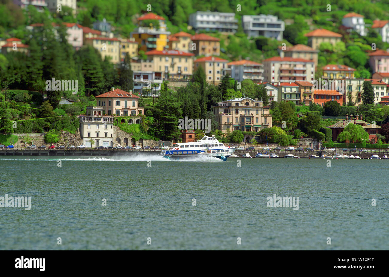 High-speed sightseeing ship sails on Lake Como in Italy Stock Photo - Alamy