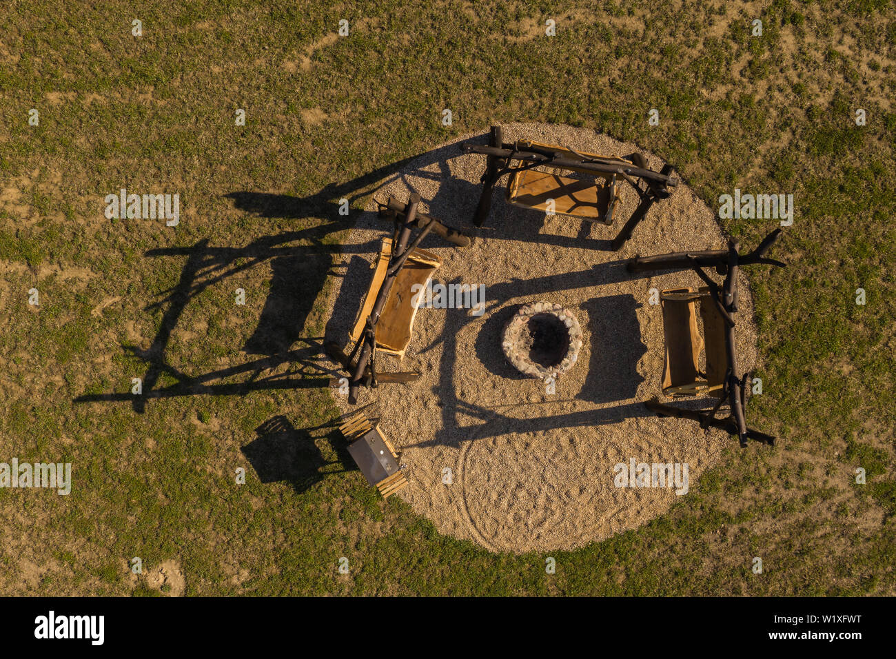 Drone top down view of camp fireplace and few wooden benches Stock ...