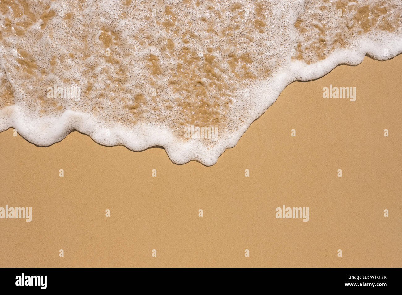 Wave on golden sand hi-res stock photography and images - Alamy