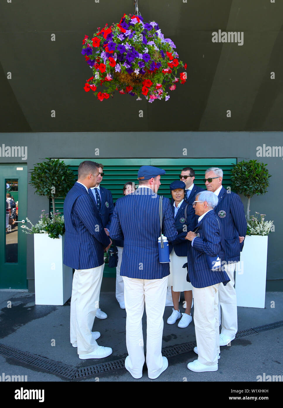 Officials waiting outside Court Two on day four of the Wimbledon ...