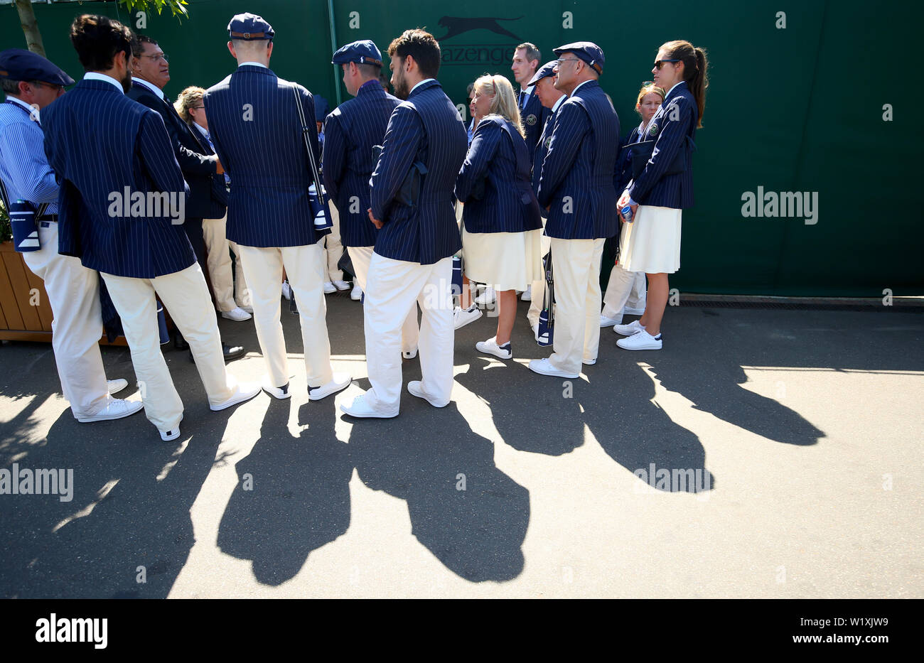 Officials waiting outside Court Two on day four of the Wimbledon ...