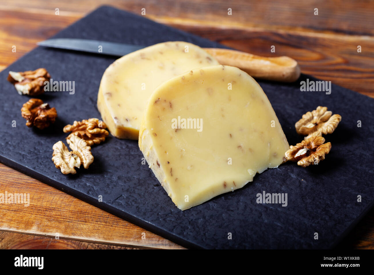 Delicious gouda cheese with walnut Stock Photo - Alamy