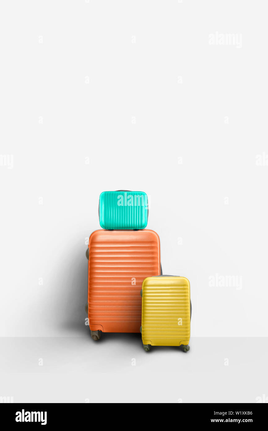 Colorful set of suitcases on pastel colors on pastel background ...