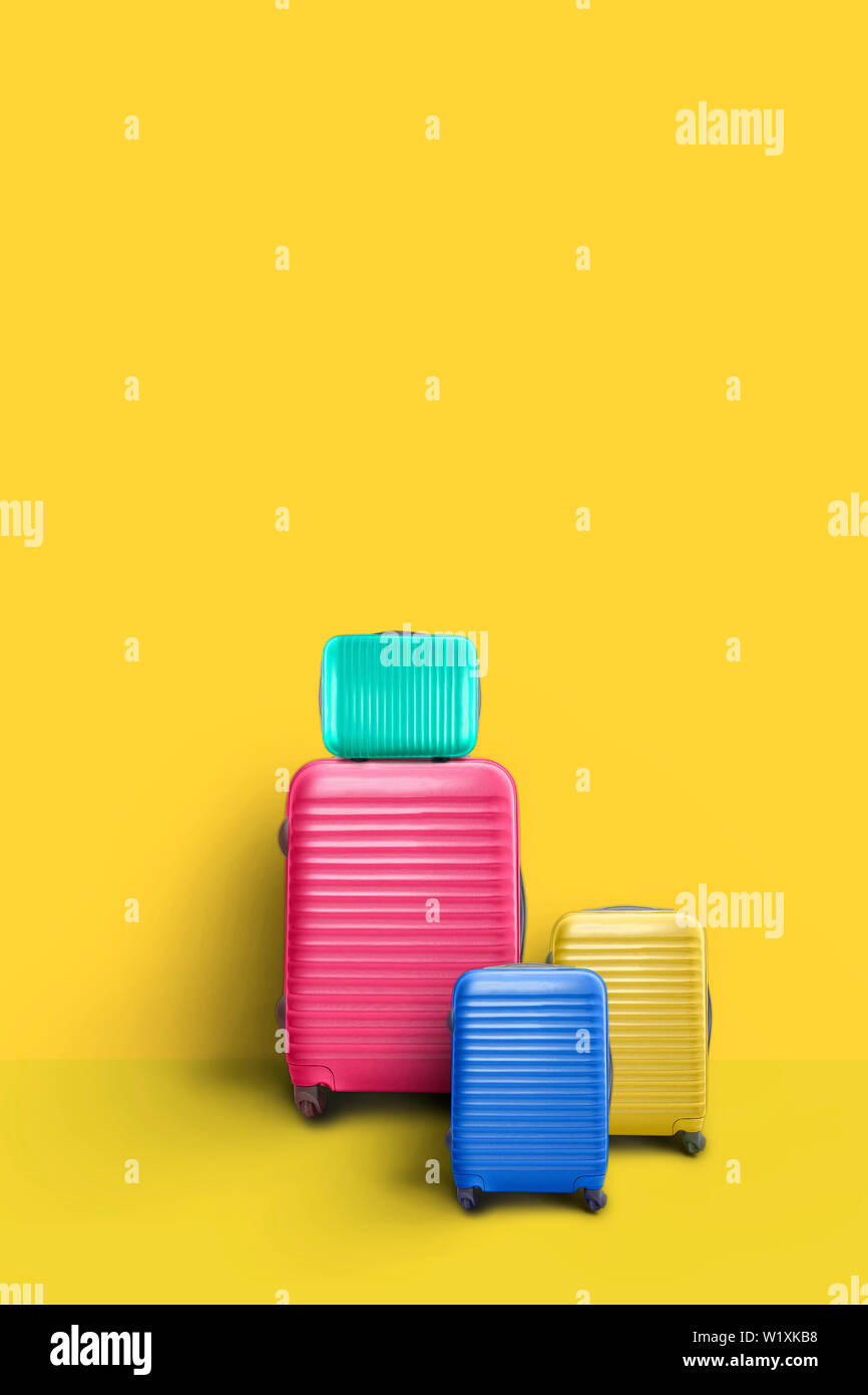 Colorful set of suitcases on pastel colors on pastel background ...
