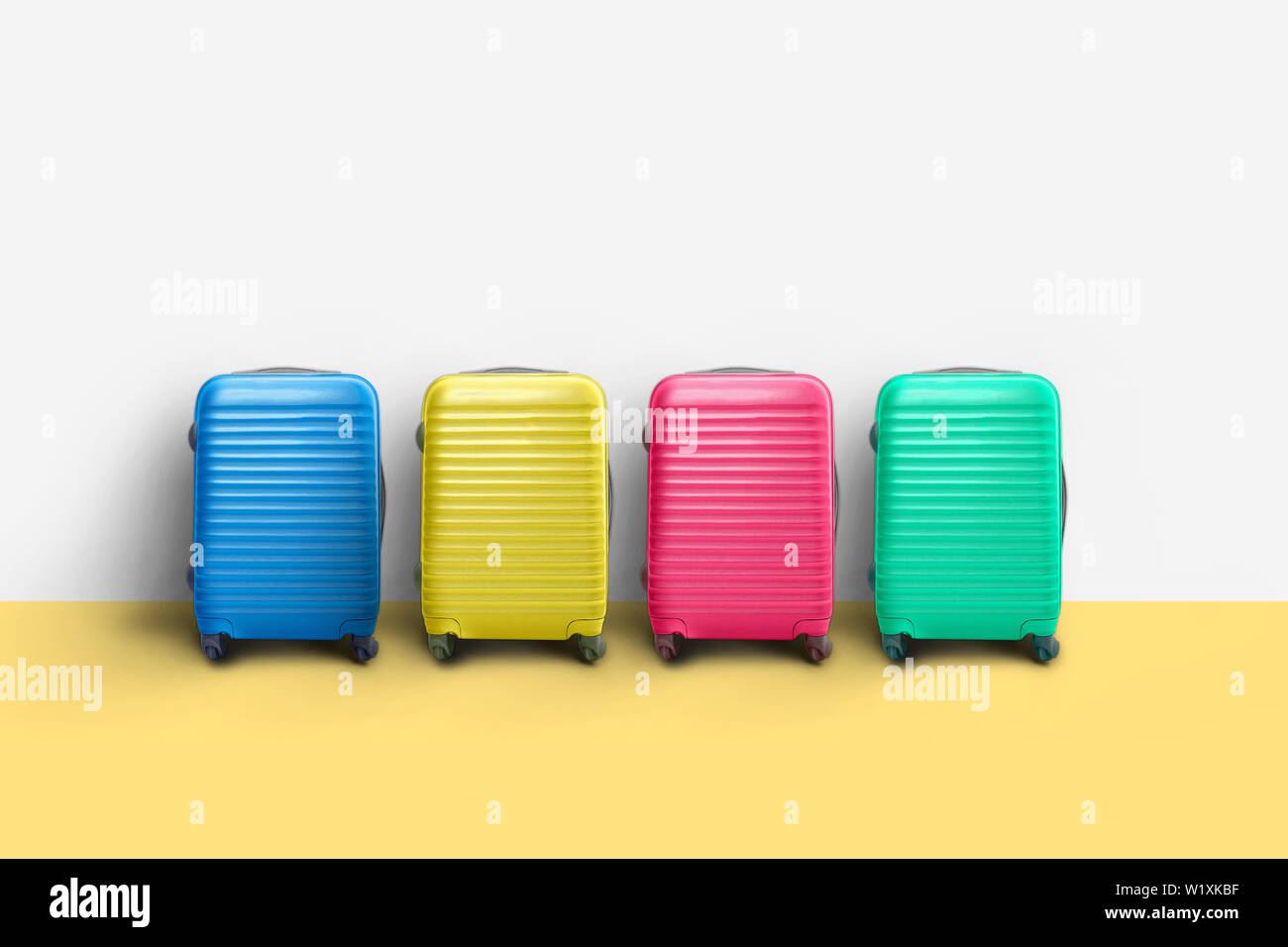 Colorful set of suitcases on pastel colors on pastel background ...