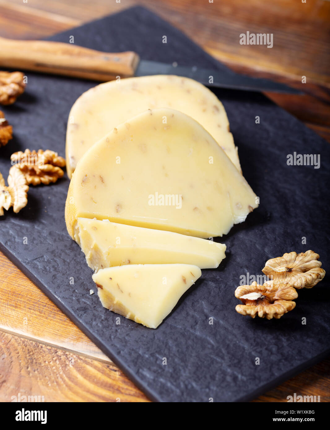 Delicious gouda cheese with walnut Stock Photo - Alamy