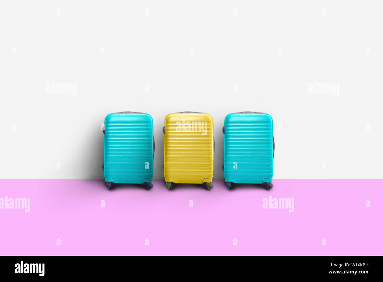 Colorful set of suitcases on pastel colors on pastel background ...