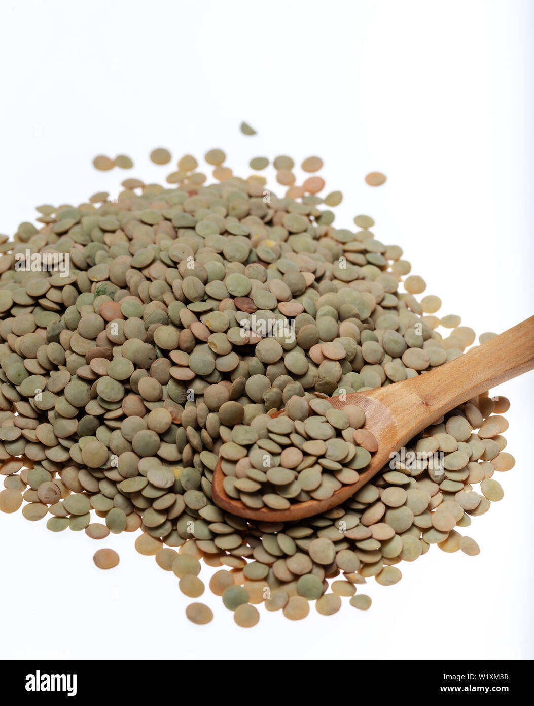 Green lentils on white background Stock Photo - Alamy