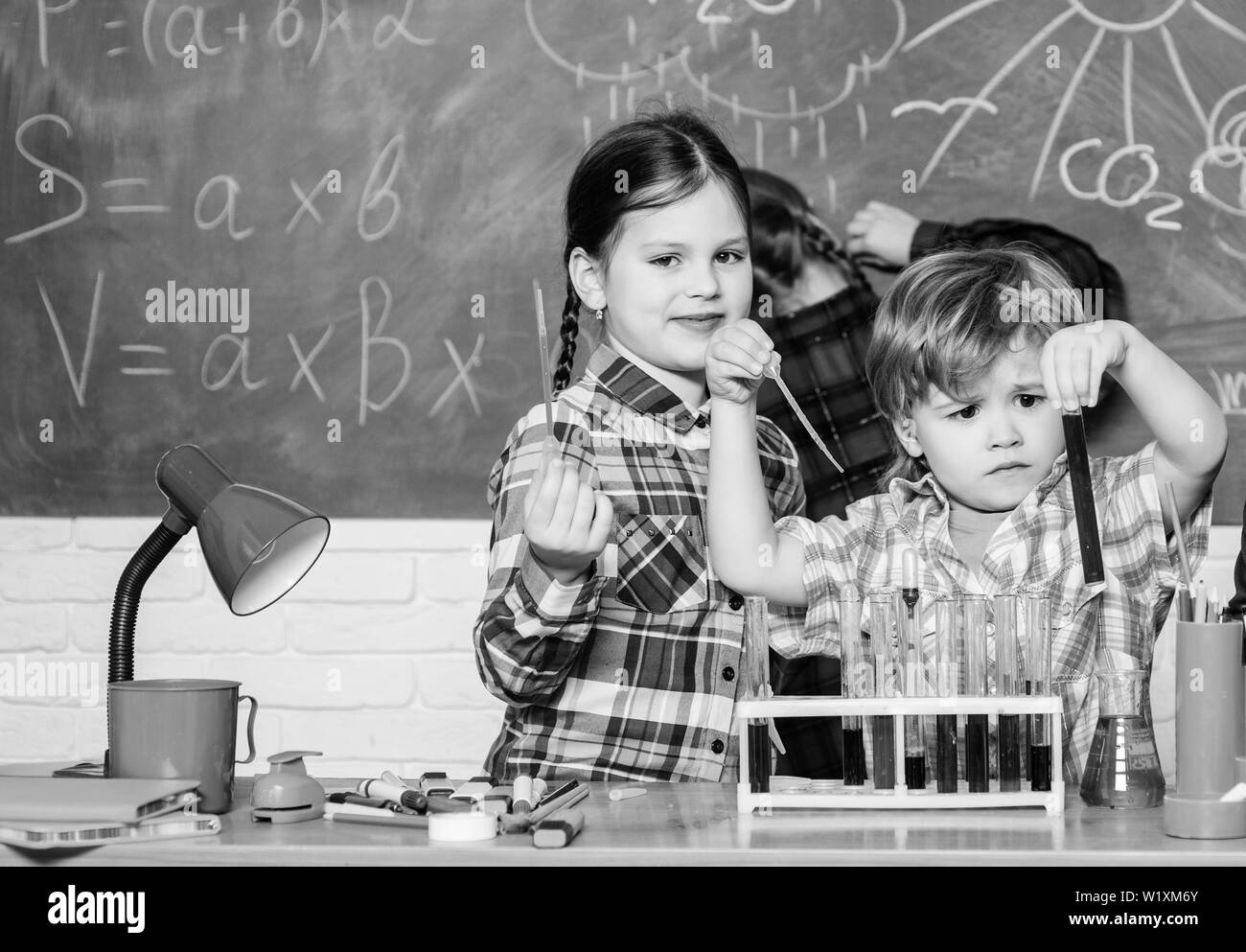 students doing science experiments with microscope in lab. back to ...