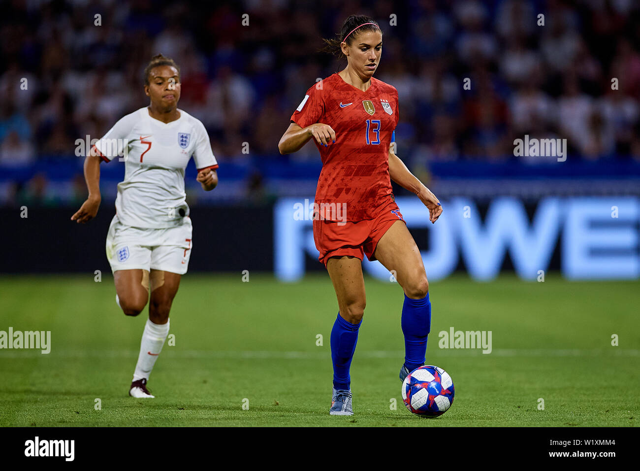 LYON, FRANCE - JULY 02: Alex Morgan (R) of USA in action next to Nikita ...