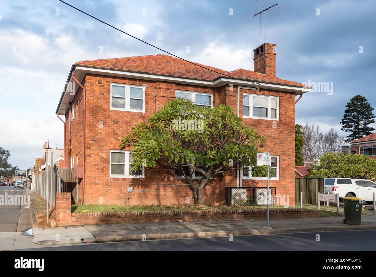 A pre-world war two, two level, double brick constructed block of units ...