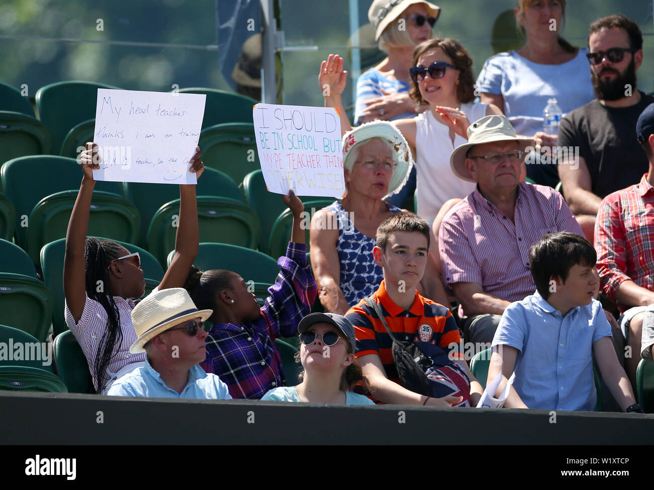 Spectators hold up signs in the stands hi-res stock photography and ...