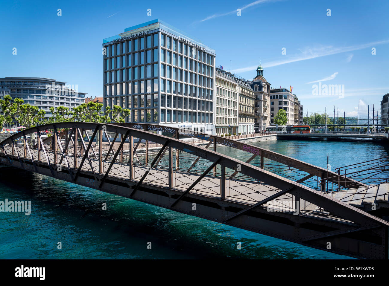 Old industrial footbridge over the Rhone in city centre, Geneva ...