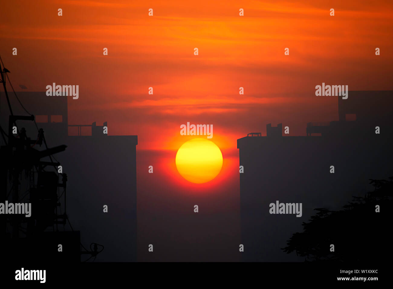 The early morning sunlight shining on large buildings Stock Photo - Alamy