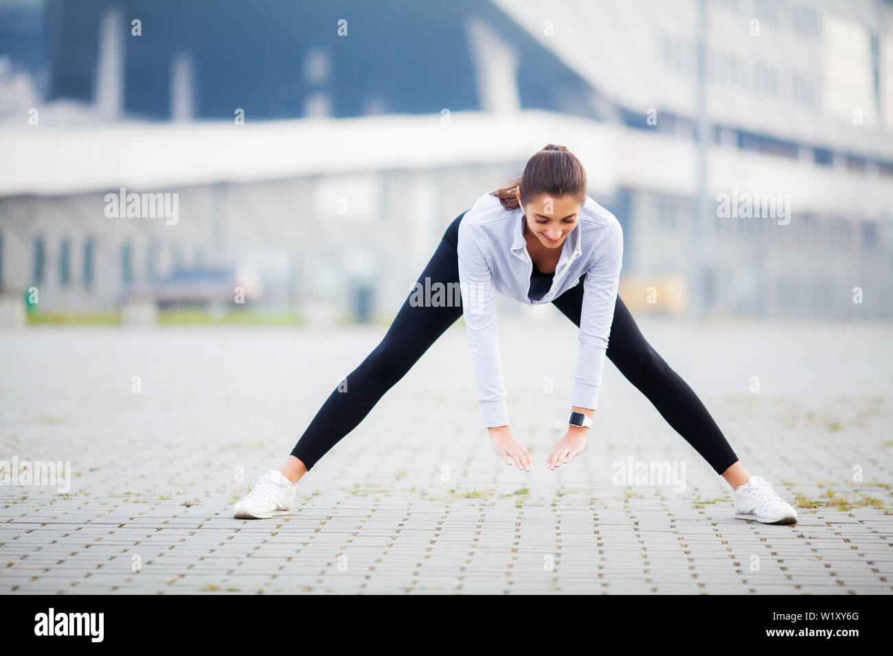 Fitness. Woman Doing Workout Exercise On Street Stock Photo - Alamy