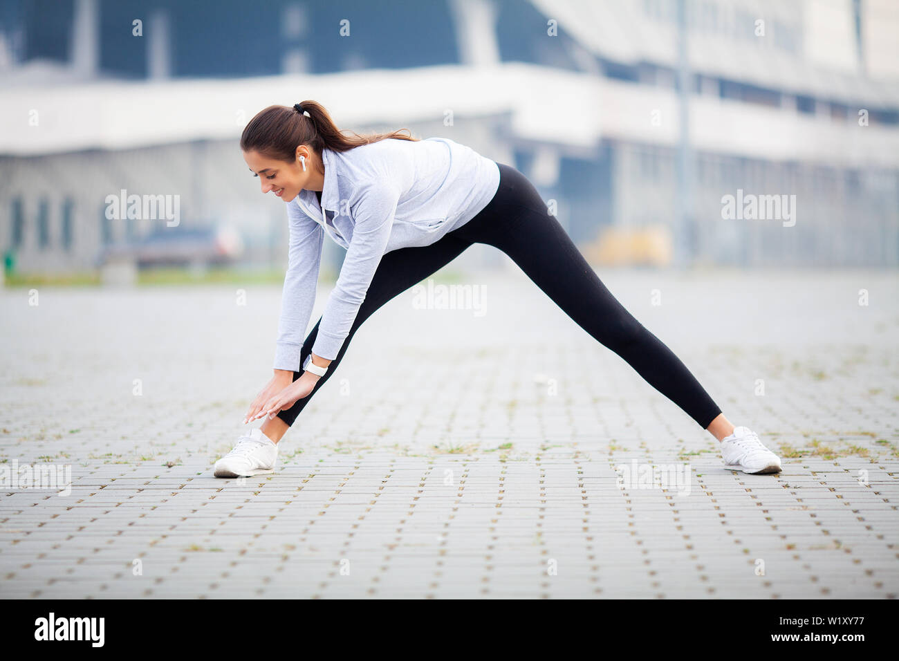 Fitness. Woman Doing Workout Exercise On Street Stock Photo - Alamy