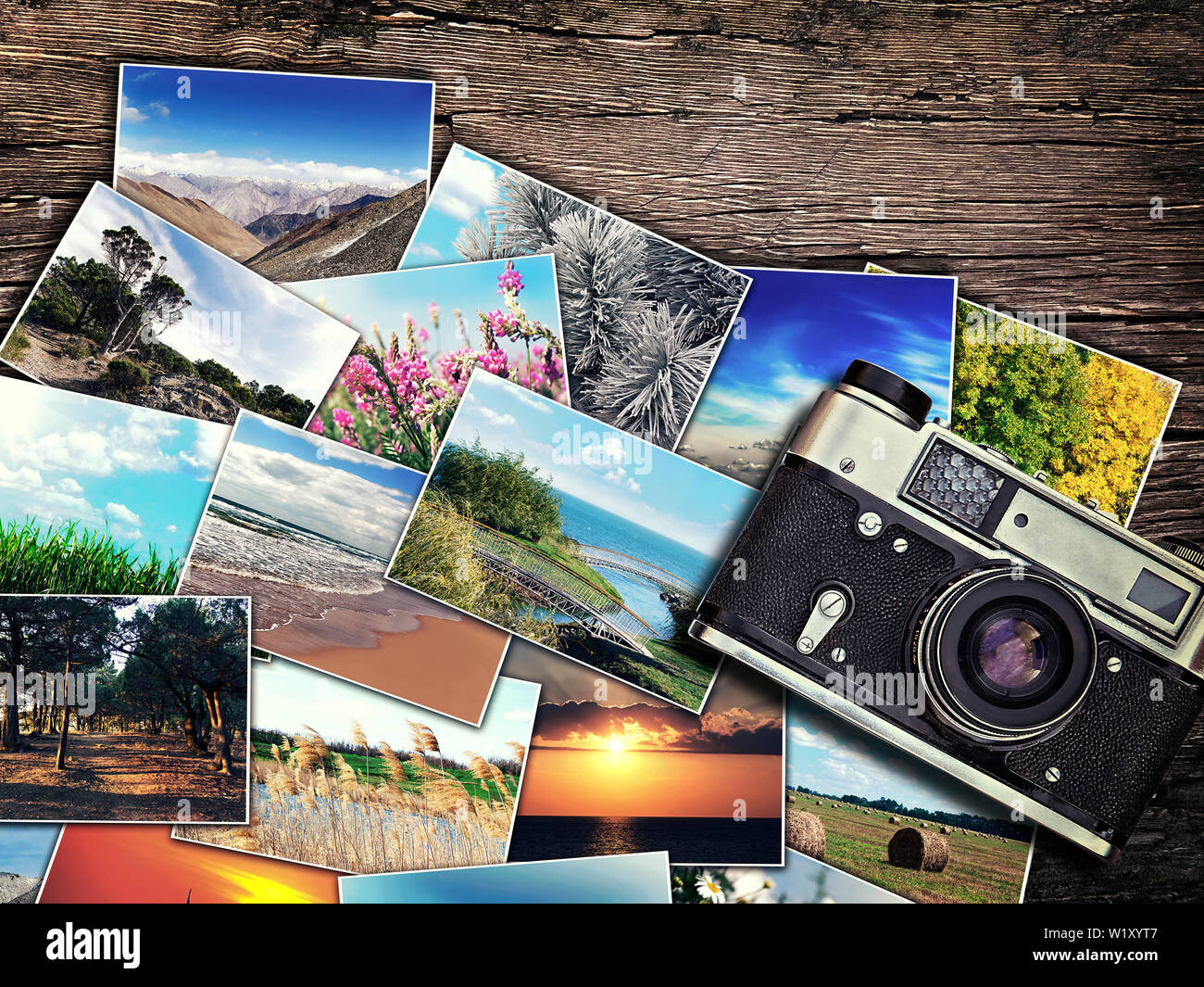 old vintage camera and photos on a wooden background Stock Photo - Alamy