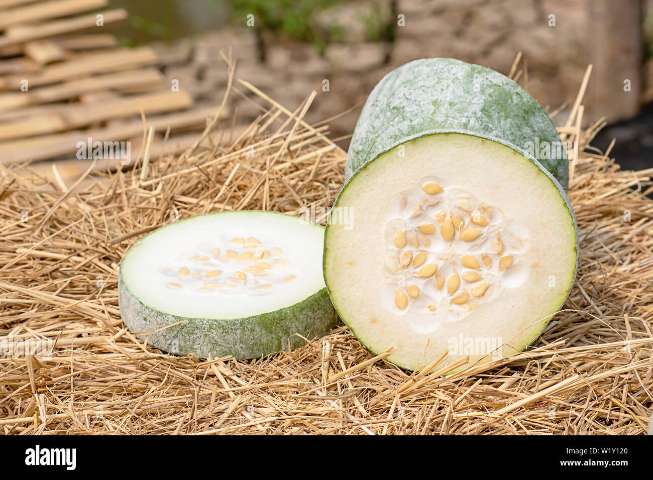 Winter melon is cut into pieces on the straw Stock Photo - Alamy
