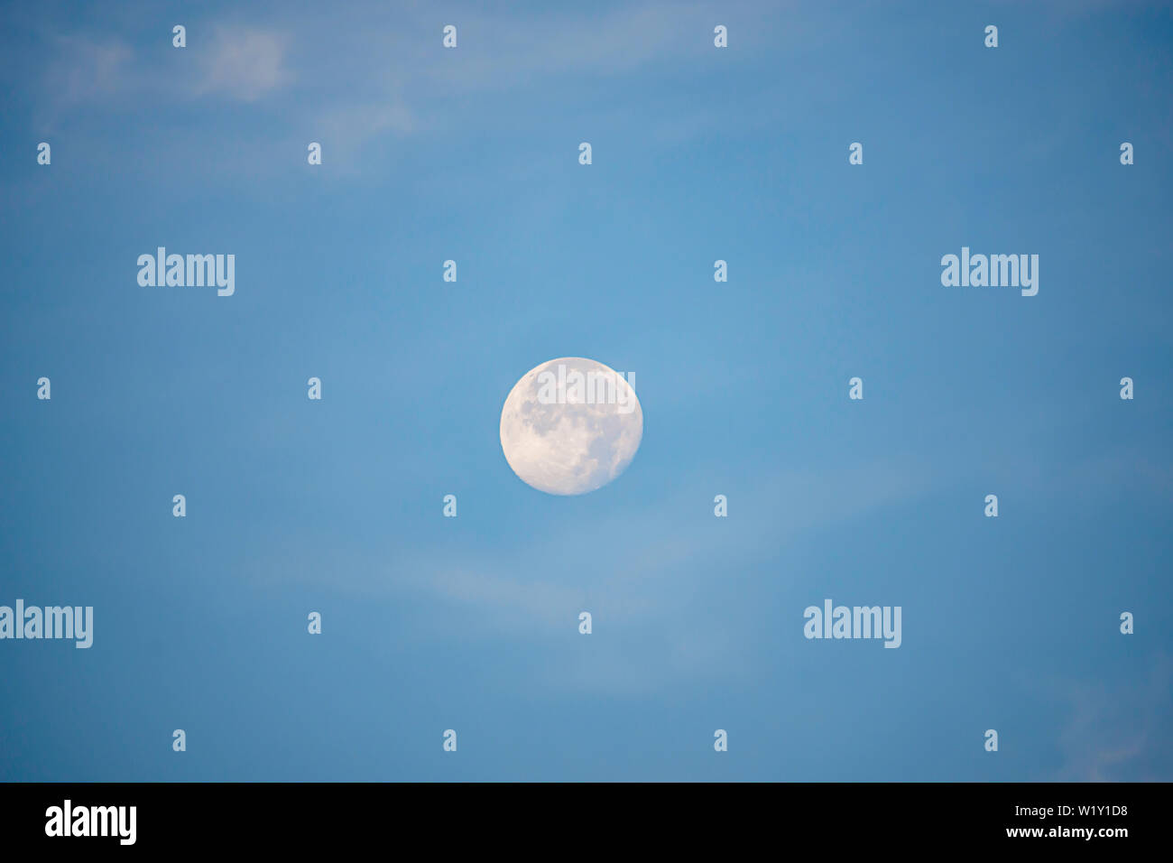 Moon in daylight On the bright sky Stock Photo - Alamy