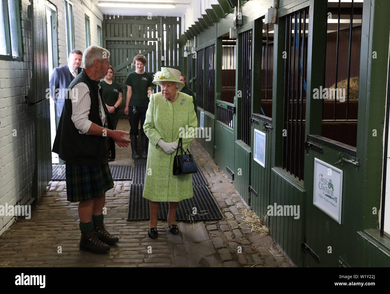 Queen Elizabeth II is shown the barns during a visit to Gorgie City ...