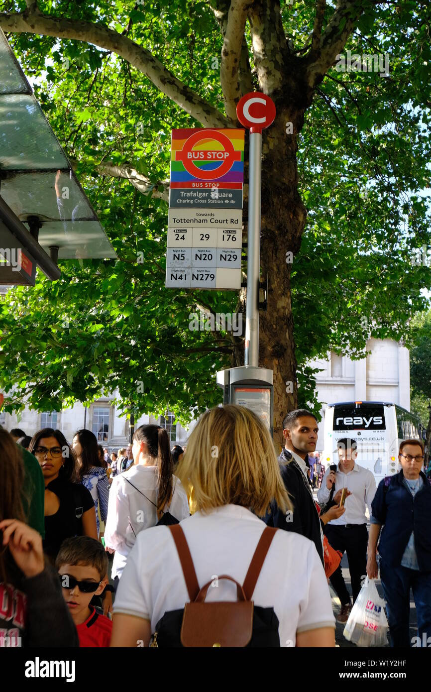 Pride in London rainbow decorated bus stop Stock Photo - Alamy