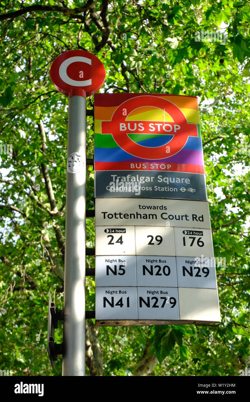 Pride in London rainbow decorated bus stop Stock Photo - Alamy