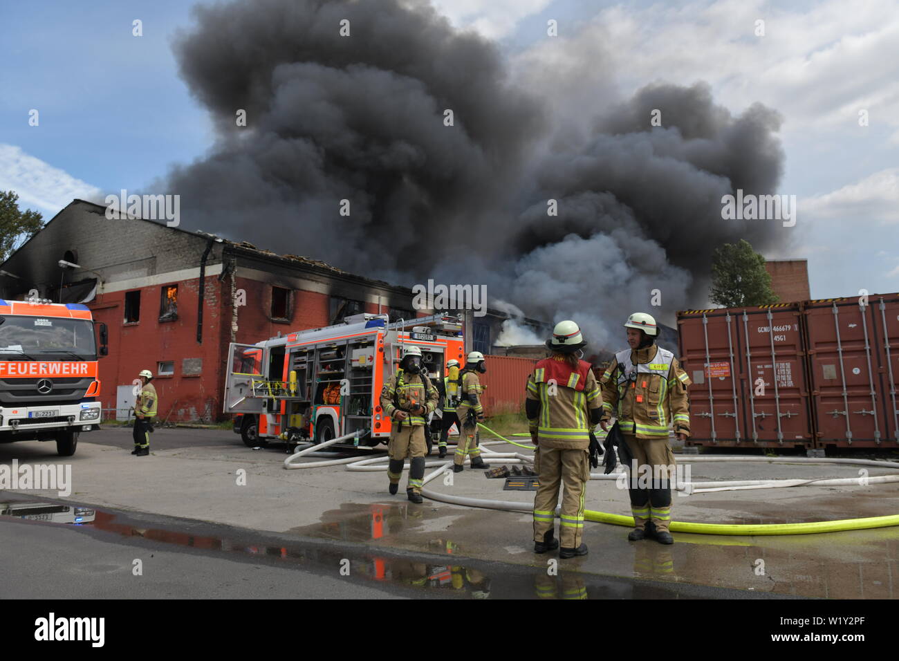 04 July 2019, Berlin: Firefighters are active in the event of a fire on ...
