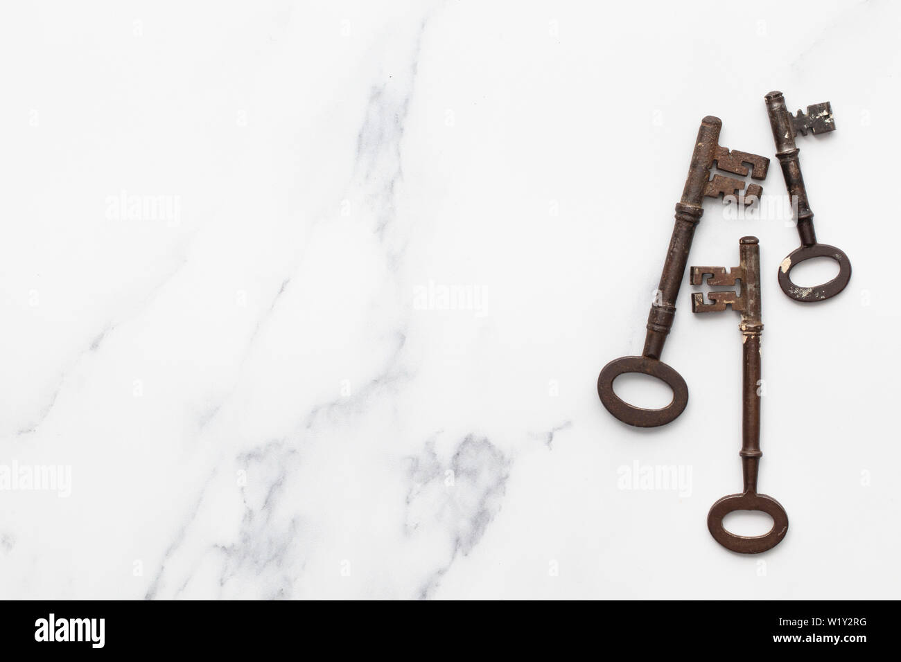 Vintage old fashioned keys on a marble background with copy space Stock ...
