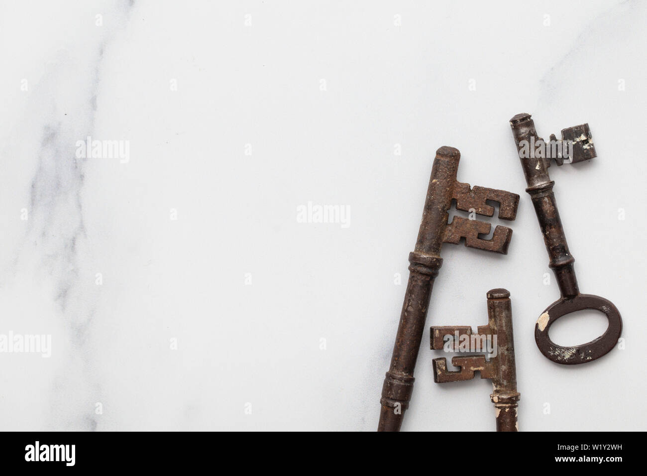 Vintage old fashioned keys on a marble background with copy space Stock ...