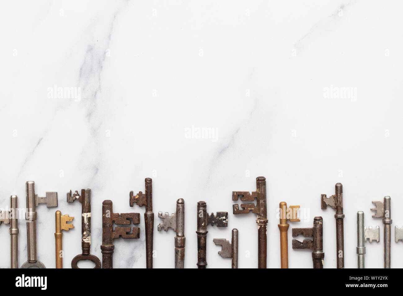 Vintage old fashioned keys on a marble background with copy space Stock ...