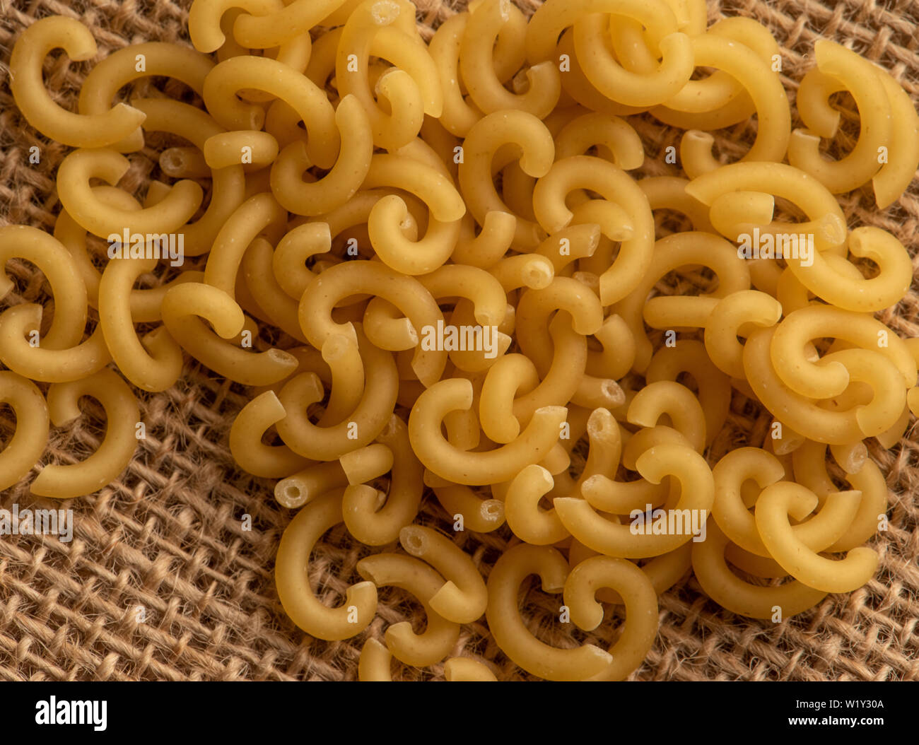 Small pasta close-up on the burlap. Carbohydrate food Stock Photo - Alamy