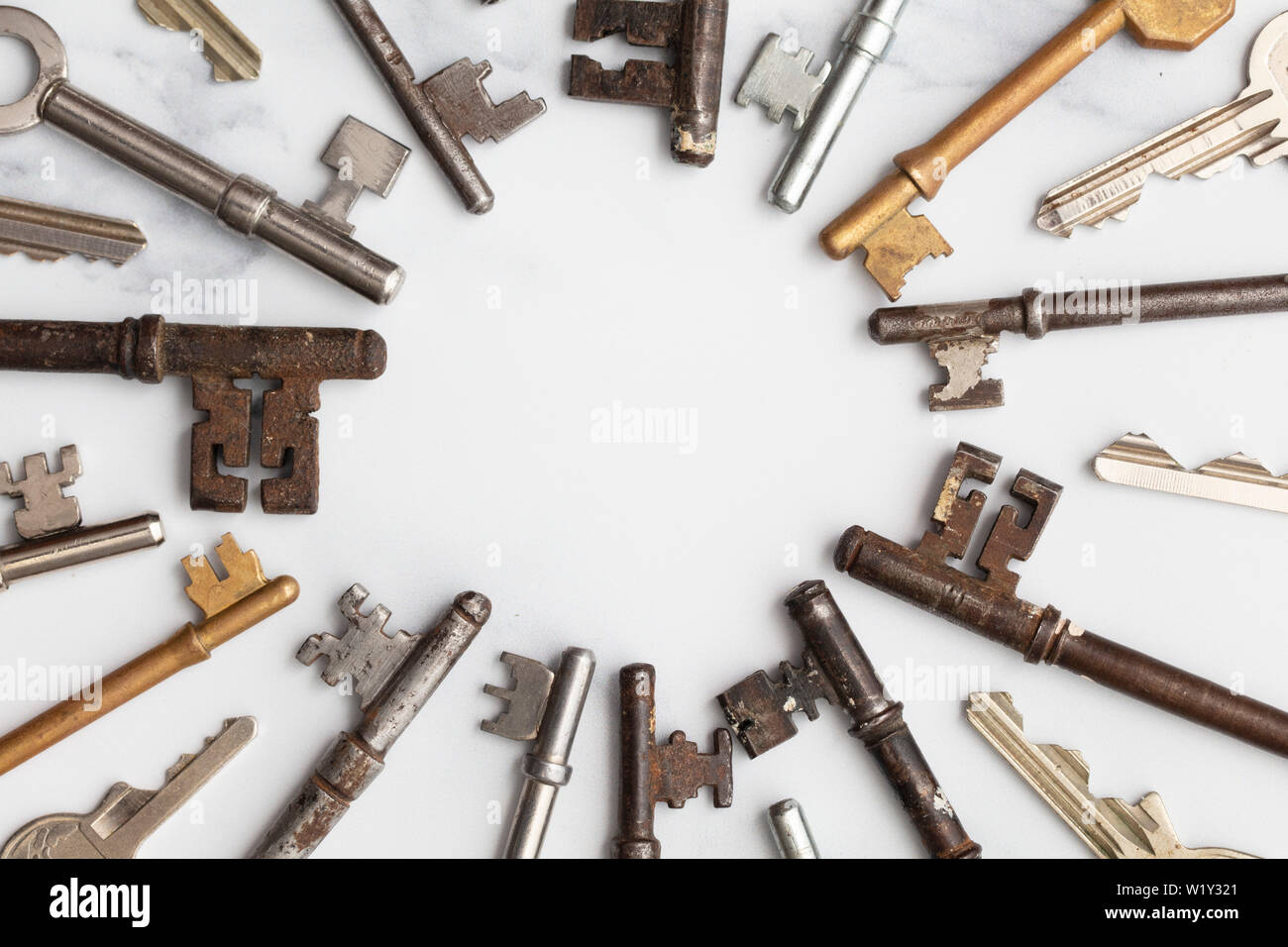 Frame of vintage keys on white background. Safety and security concept ...