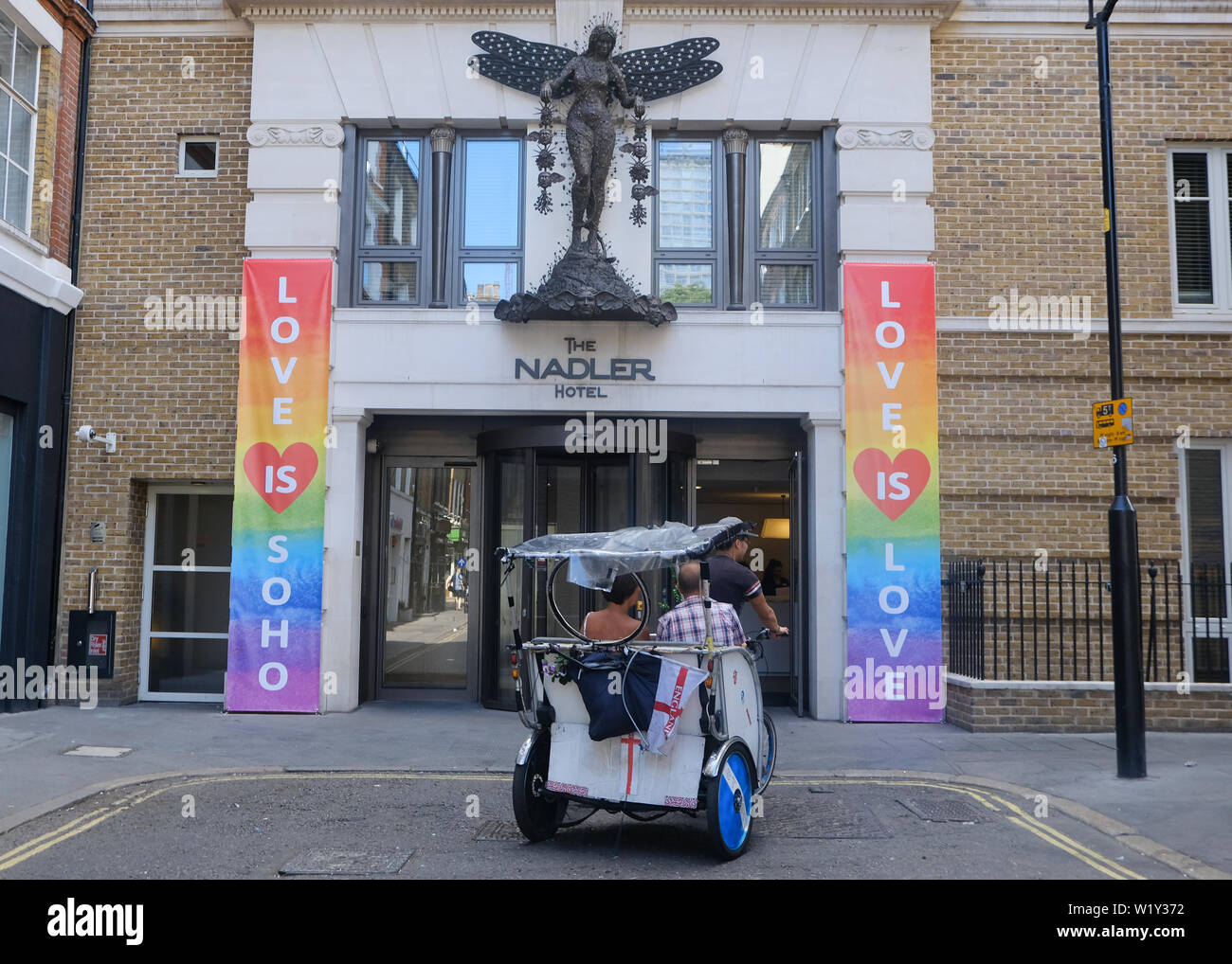 The Nadler Hotel in Soho with rickshaw passing by Stock Photo - Alamy