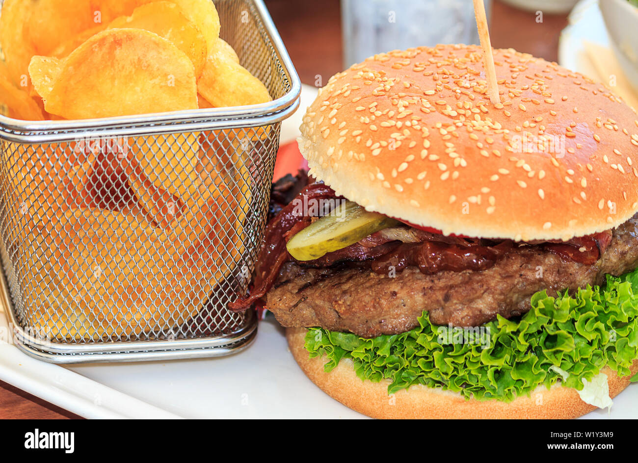 Tasty Burger with Chips Stock Photo - Alamy