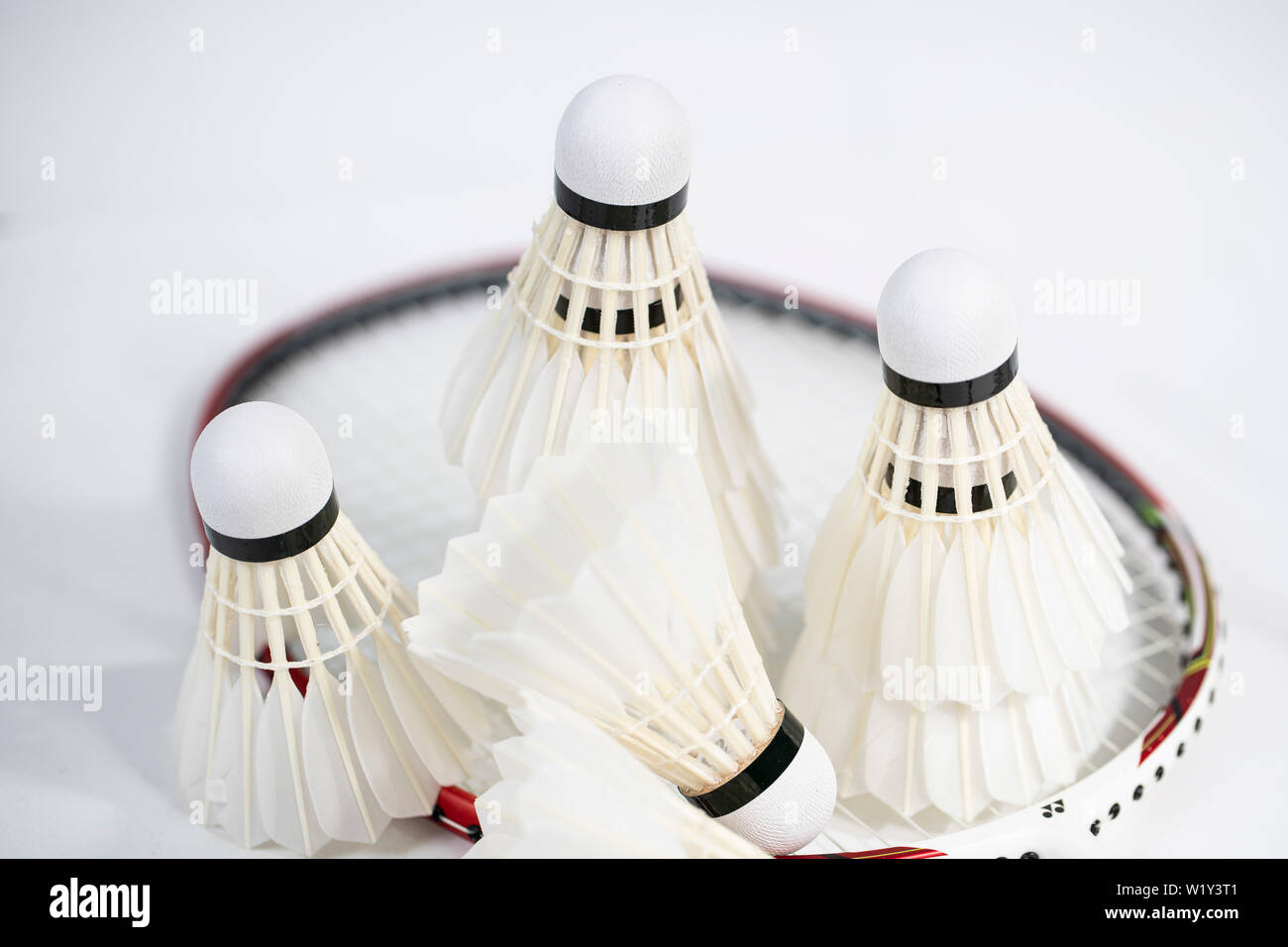 white badminton shuttlecocks lay on white table background Stock Photo ...